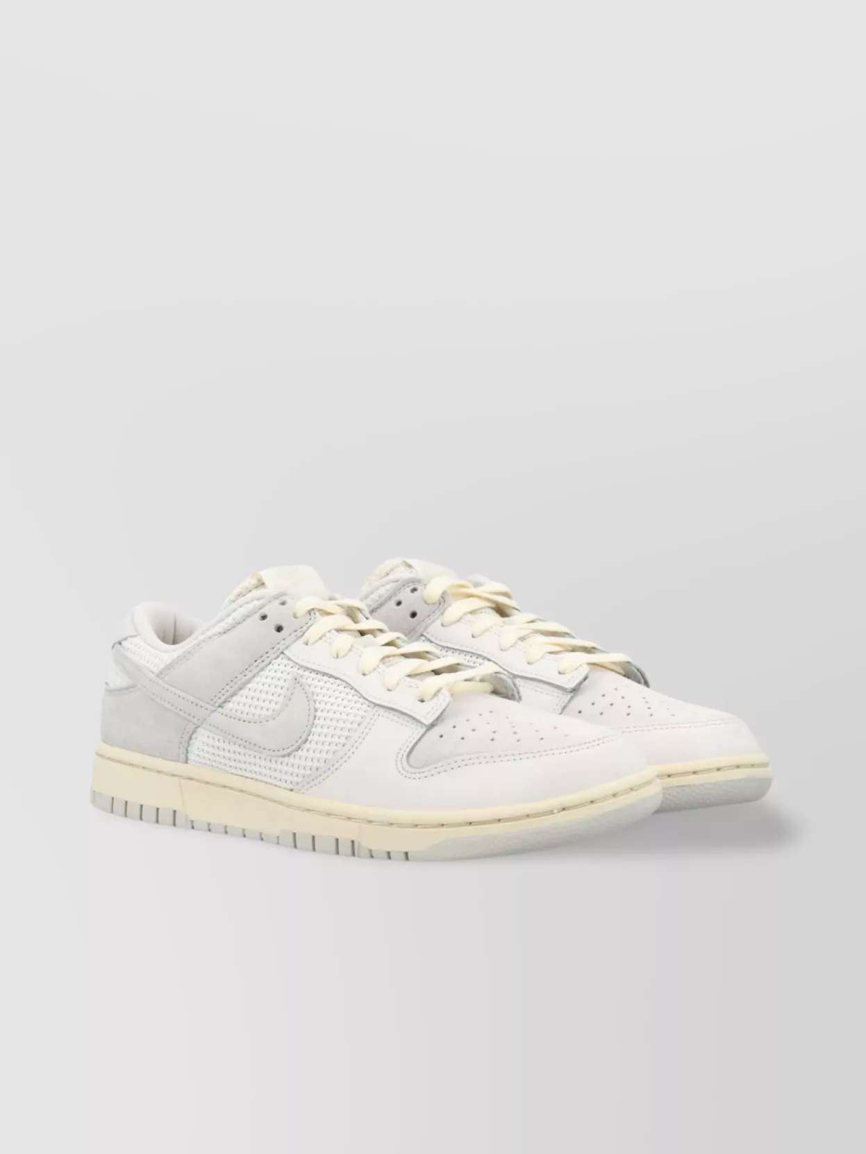 Nike Low cut perforated rubber sole sneakers | The Fashion Square
